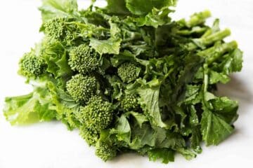 Rapini (Broccoli Rabe) with Raisins and Hazelnuts - Pinch and Swirl