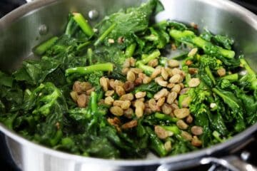 Rapini (Broccoli Rabe) with Raisins and Hazelnuts - Pinch and Swirl