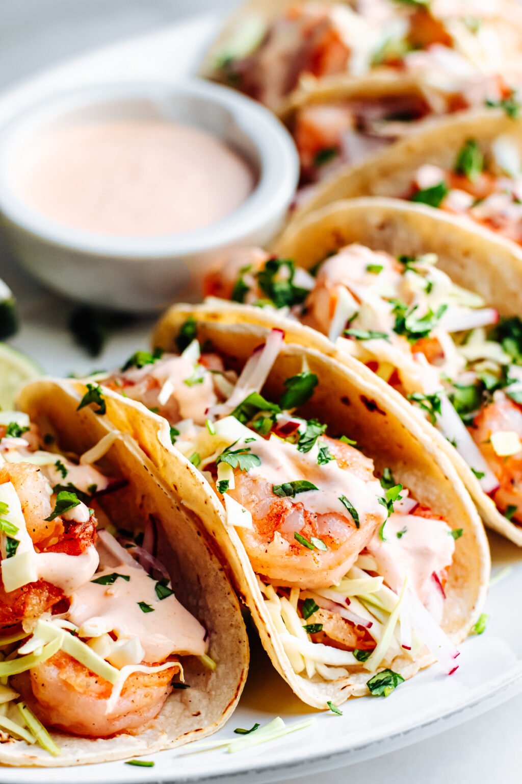 Easy Shrimp Tacos (Crunchy Slaw & Creamy Sauce!) - Pinch and Swirl